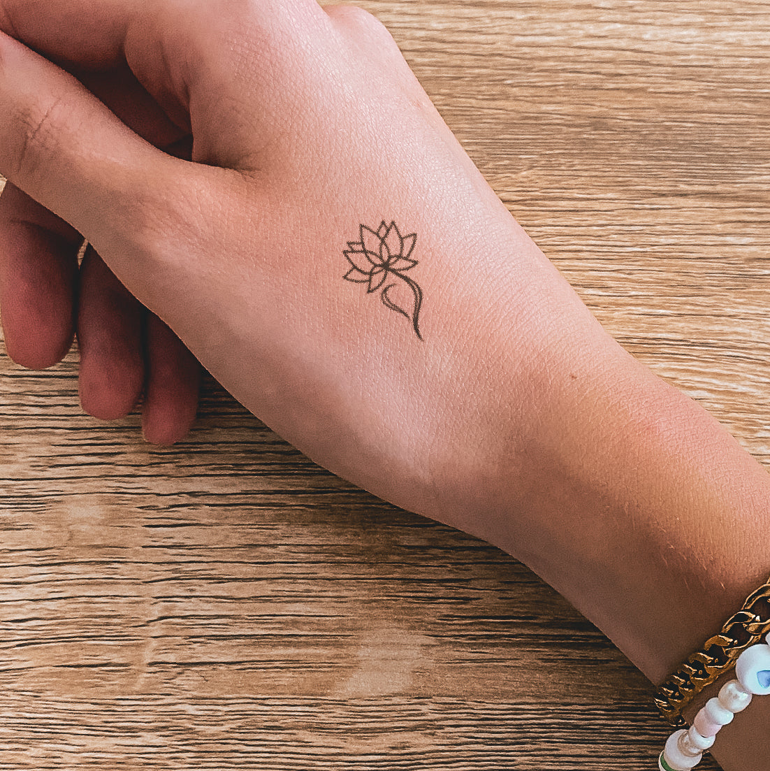 Small Lotus Flower Tattoo